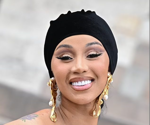 Cardi B shows off her famous curves in a statement black dress paired ...
